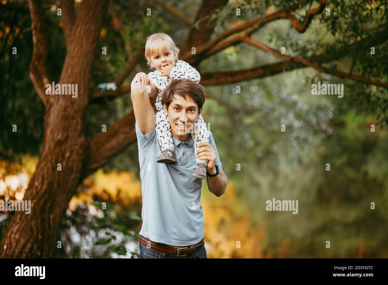 happy family father and son walking in nature Stock Photo - Alamy