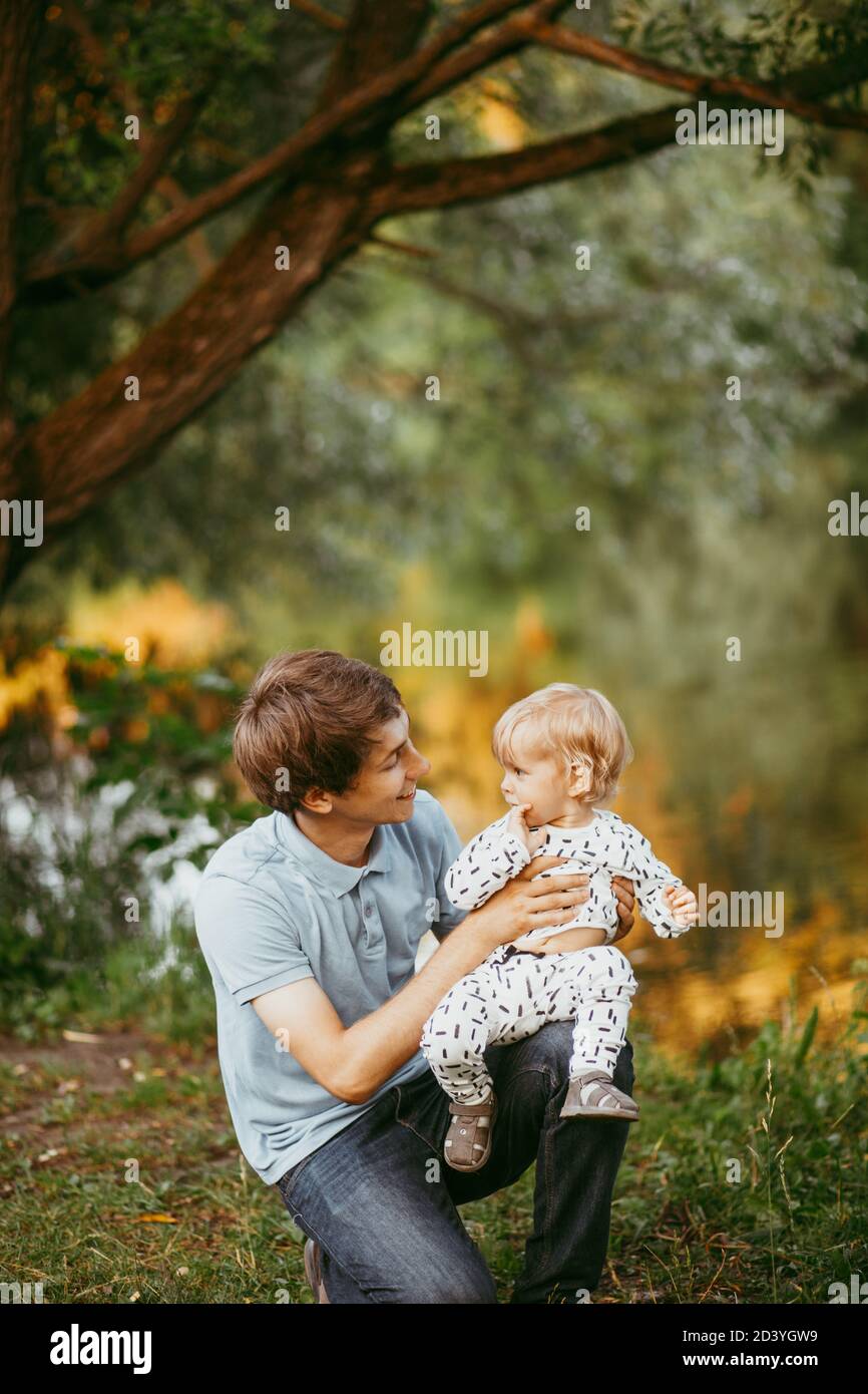happy family father and son walking in nature Stock Photo - Alamy