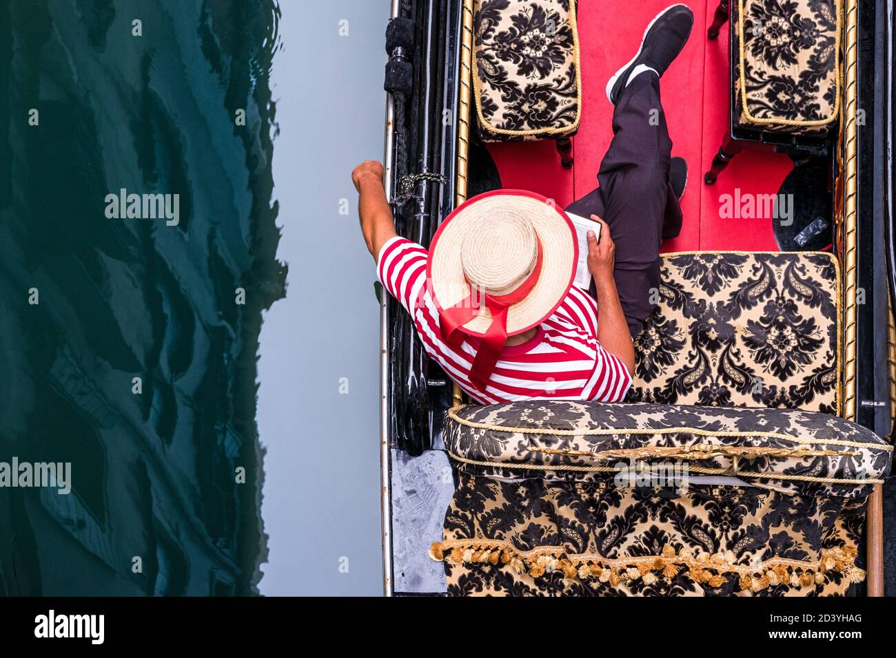 Gondolier relaxing in his gondola hi-res stock photography and images ...