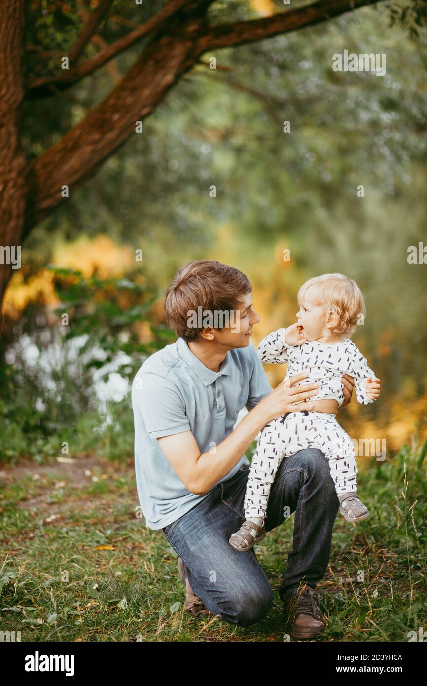 happy family father and son walking in nature Stock Photo - Alamy