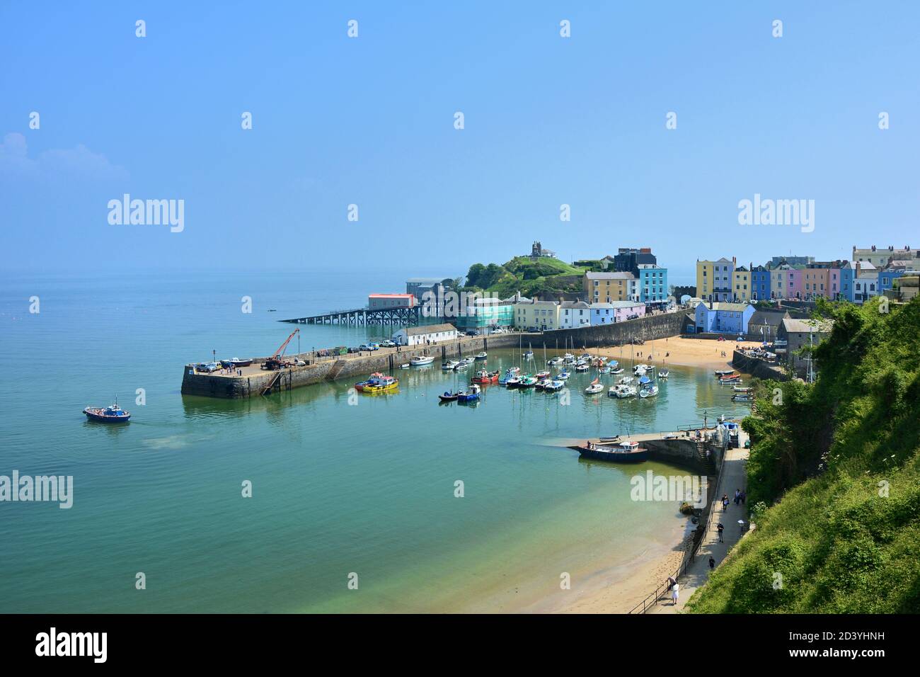 View of the harbour and colourful facades of the old town of Tenby ...