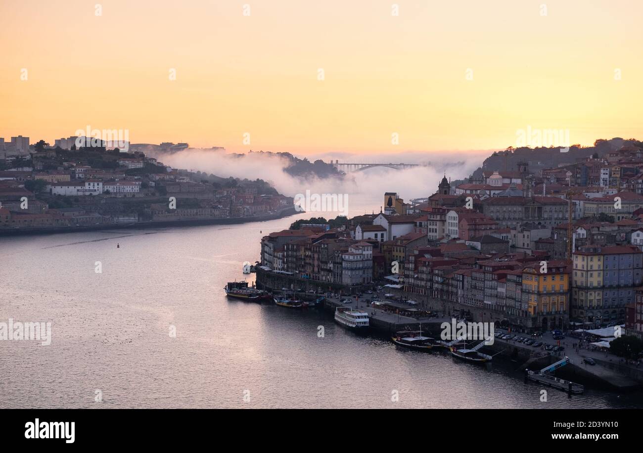 overview of Porto and Arrabida bridge in the distance at sunset from ...
