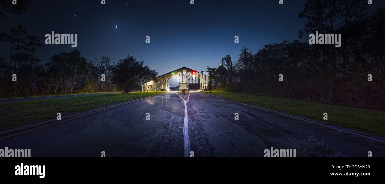 The entrance to Everglades National Park at night with a crescent moon ...
