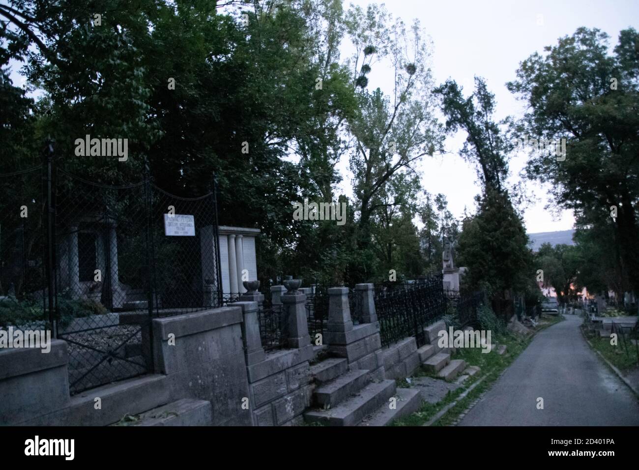 A side view of old graves and a little bit of alley Stock Photo - Alamy
