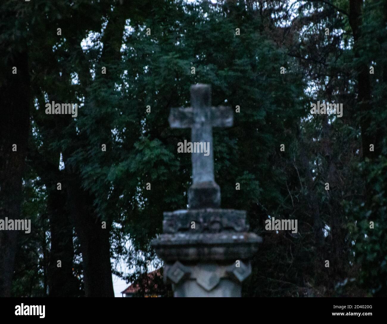 A creepy cross from a gravestone from an old cemetery.A close up view ...