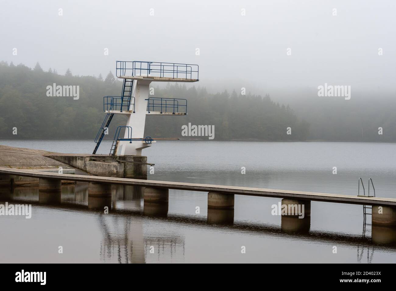 View of a swimming area, a jump tower with ladders Stock Photo - Alamy