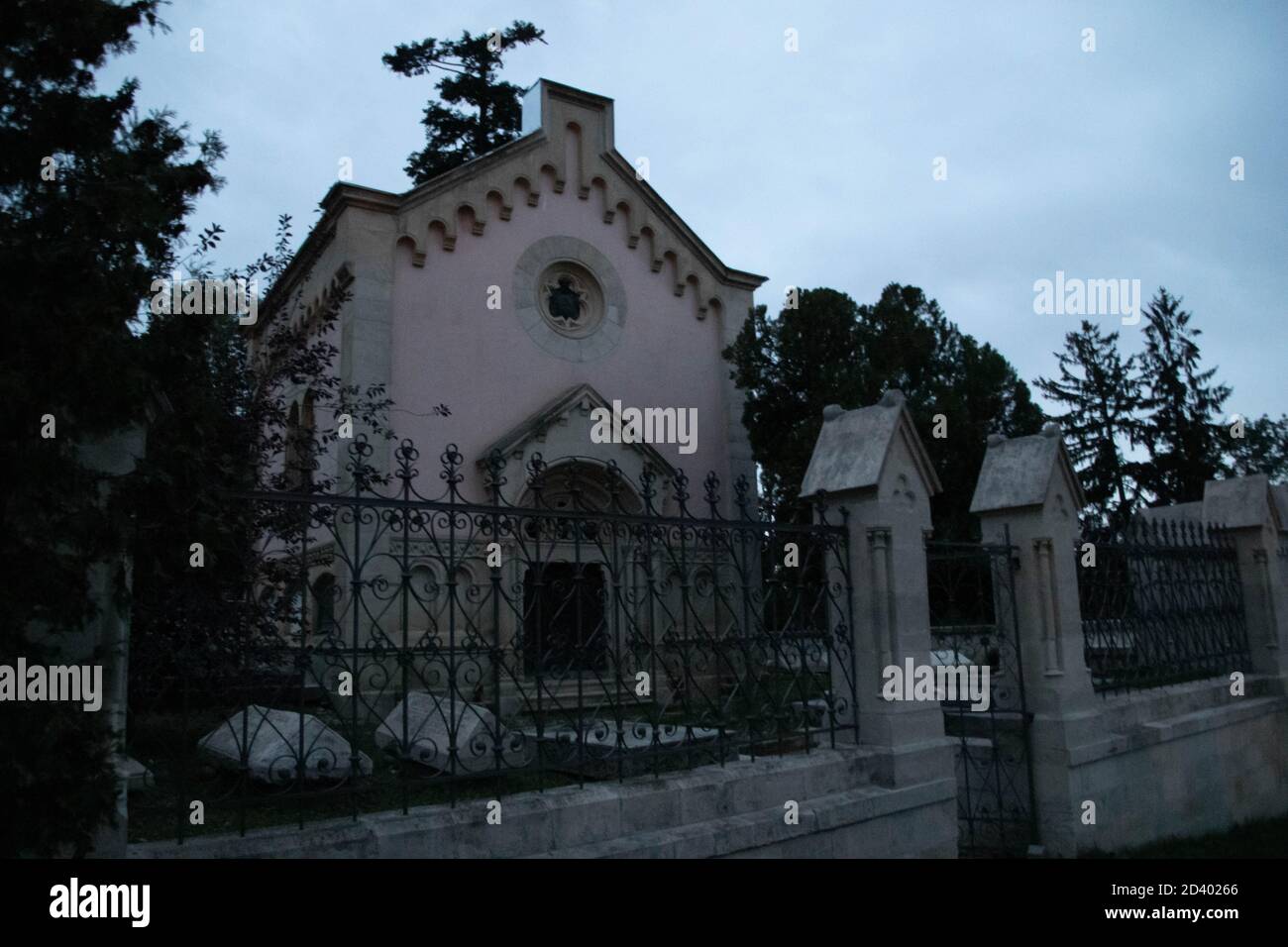 The pink Baroque crypt and the yard with old graves, also the crypt is ...