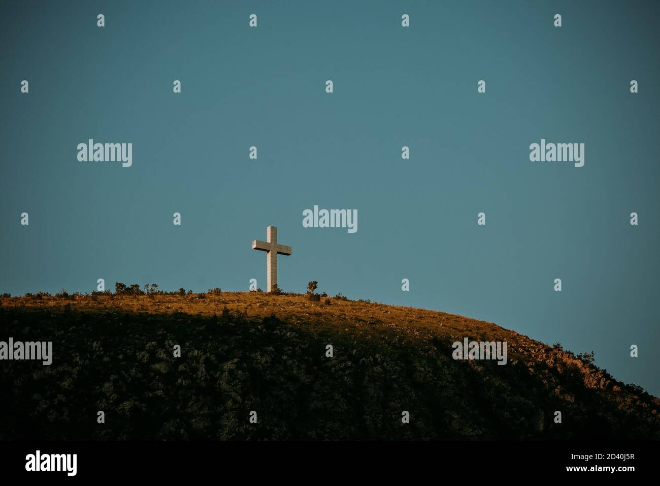 Tall cross statue on top of a hill in Mostar, Bosnia and Herzegovina ...