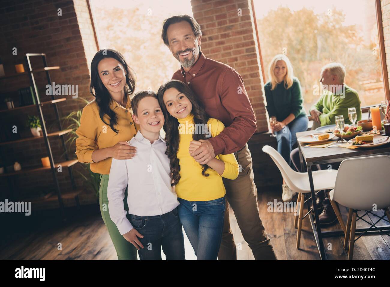 Photo of full family gathering six people two little kids embrace ...