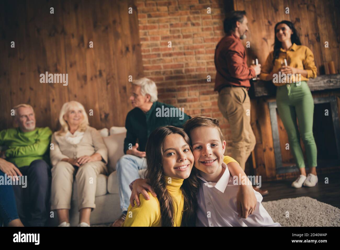 Photo of full family seven people gathering two little kids embrace ...
