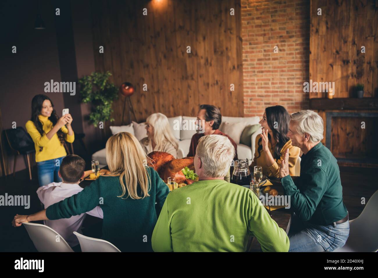 Photo of full family gathering eight people little daughter hold ...