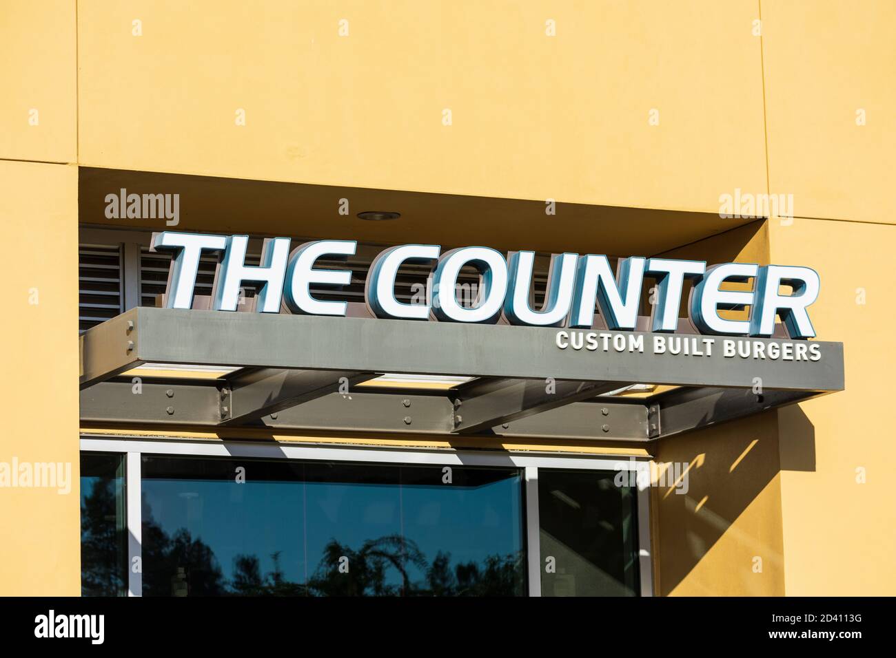 The Counter custom built burgers sign above the entrance to a ...