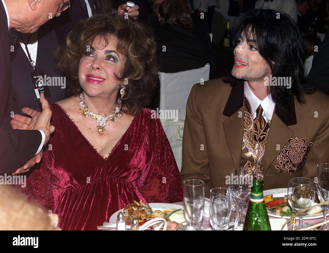 Actress Elizabeth Taylor and Michael Jackson greet a well-wisher as ...