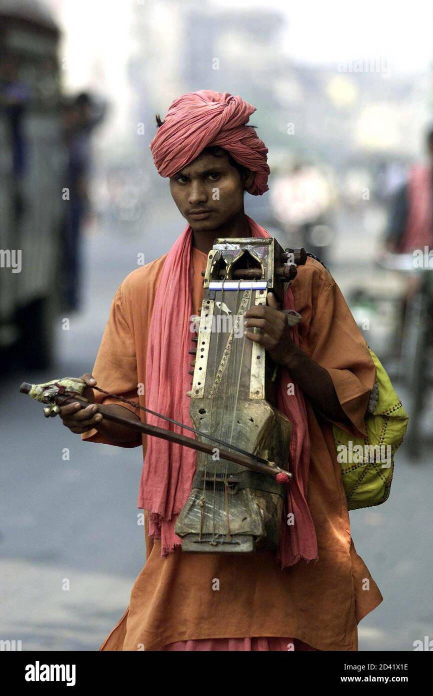 Indian man plays musical instrument High Resolution Stock Photography ...