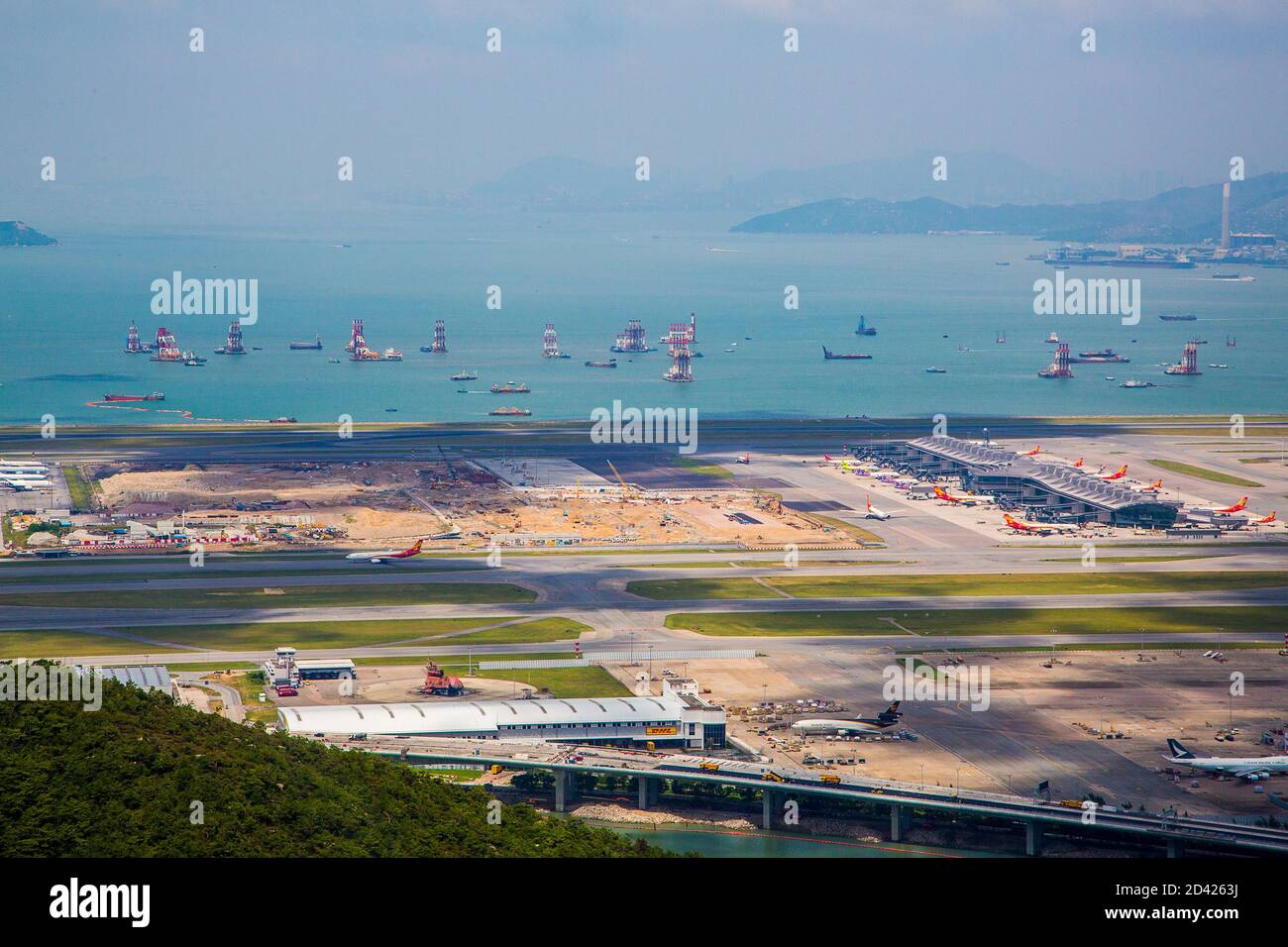 Aerial view of the Lantau island bridge and the ocean in Hong Kong on a ...