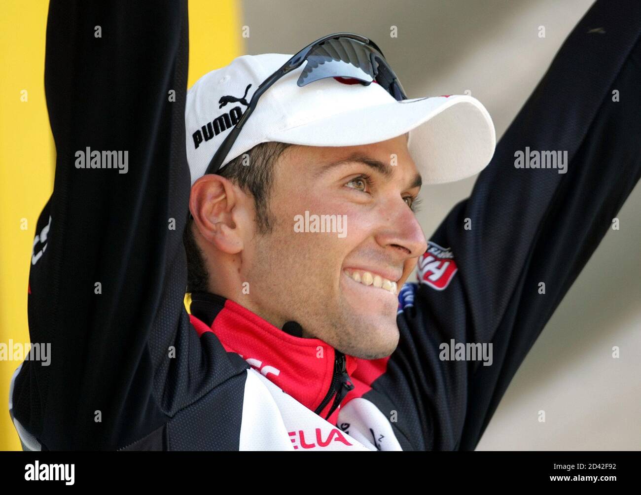Team CSC rider Ivan Basso of Italy celebrates on the podium after ...
