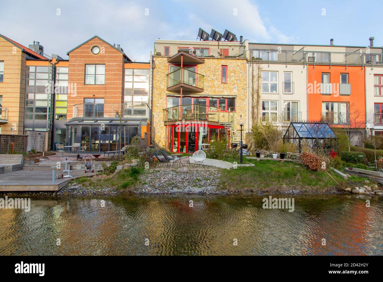 Beautiful shot houses by the canal in Malmo city, Sweden on a clear sky ...