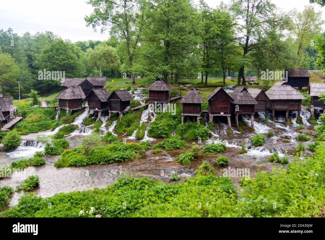 Rustic watermills on river Stock Photo - Alamy