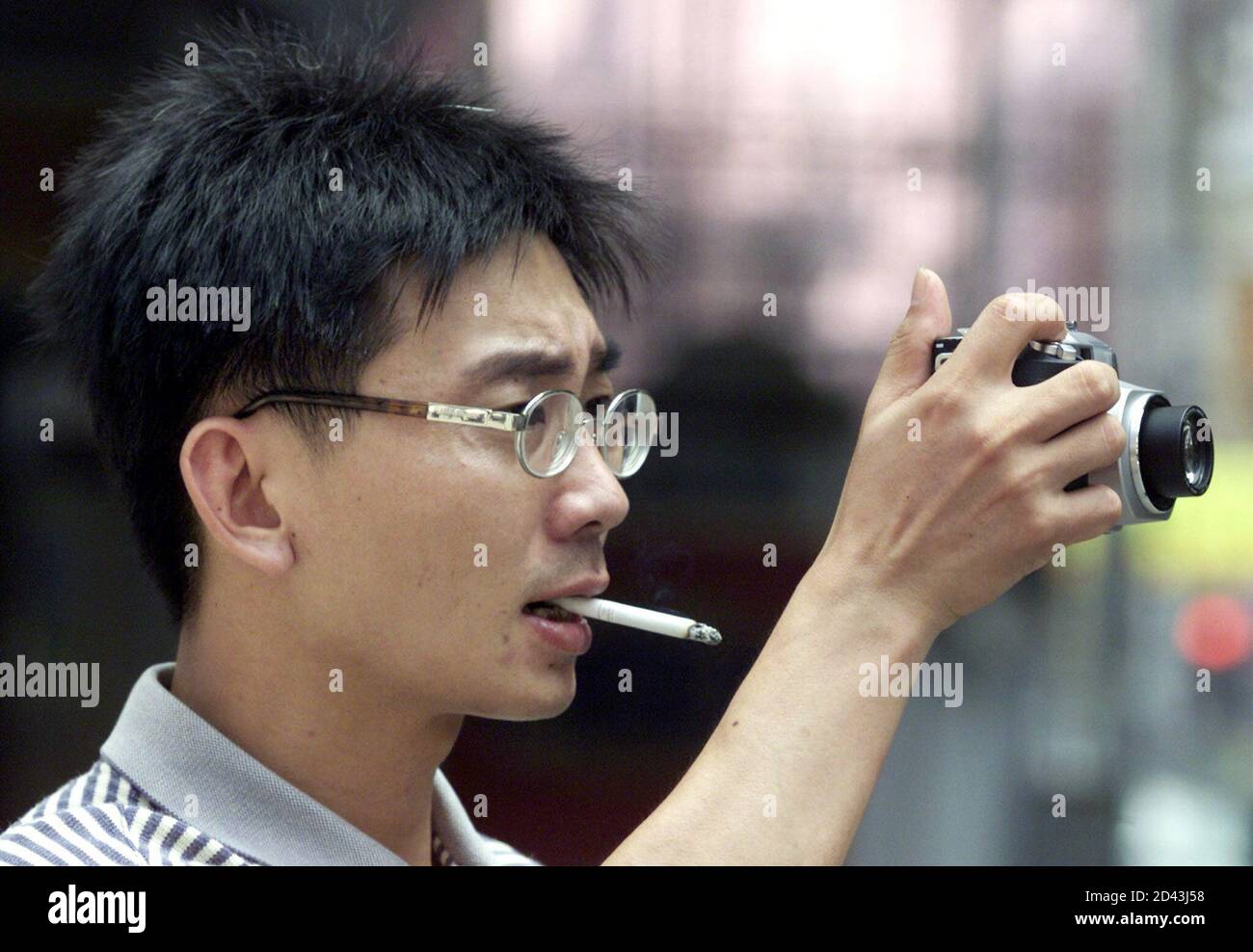 Middle aged man sitting smoking in hi-res stock photography and images ...