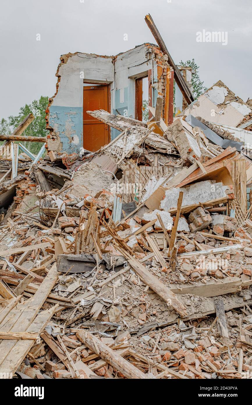 Rubble of old ruined house. Pile of construction fragments in ruins ...