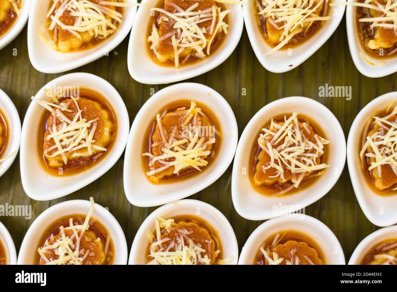 BIte sized leche flan canapes at a food buffet at a local resort in ...