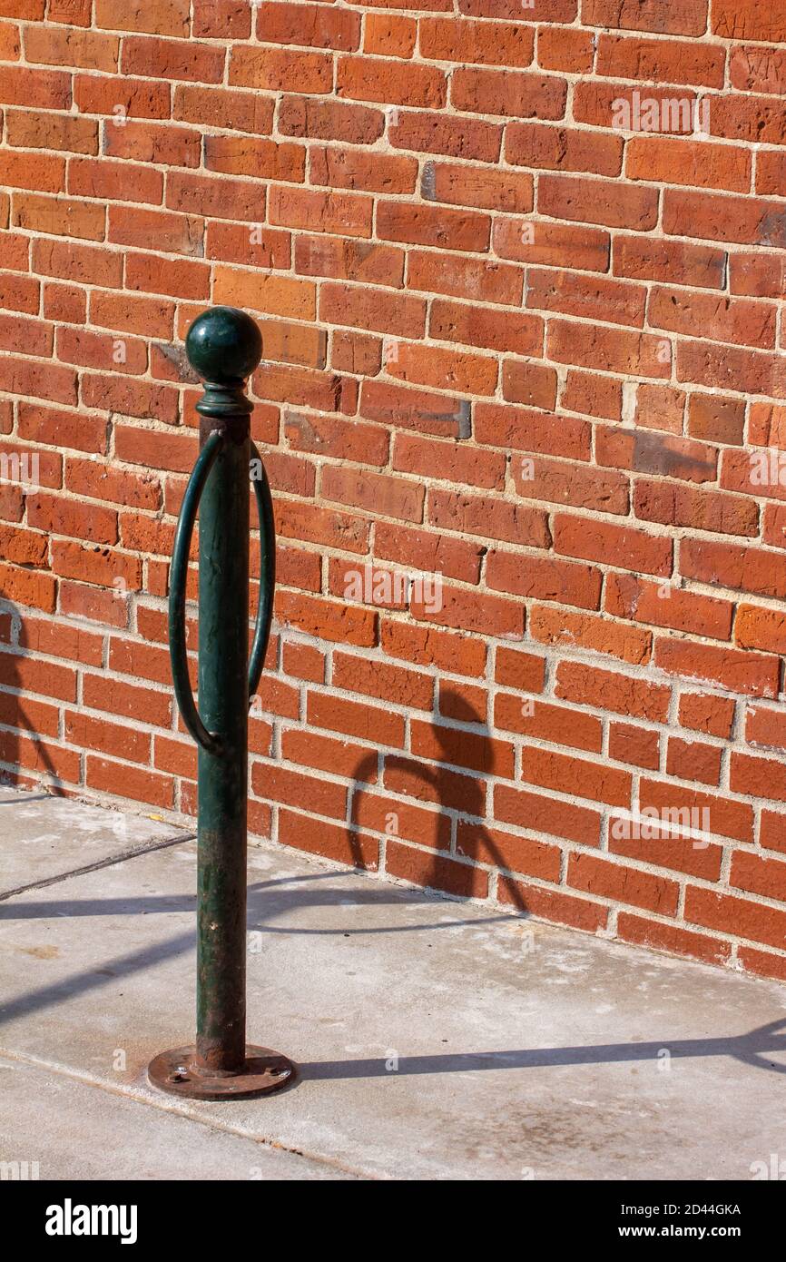 Close up view of a vintage western style hitching post bicycle rack ...