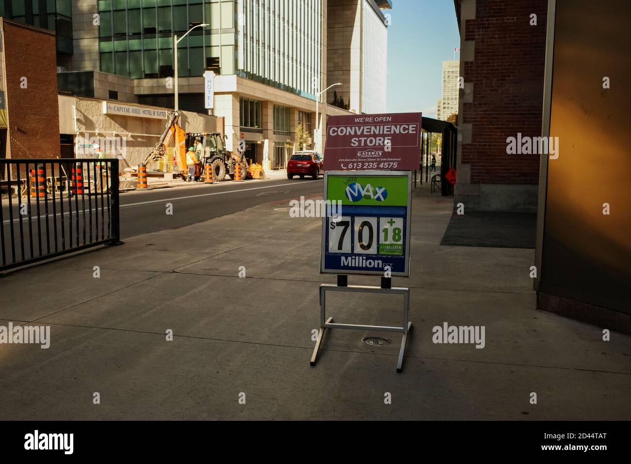 A sidewalk sign outside a convenience store in downtown Ottawa, Ontario ...