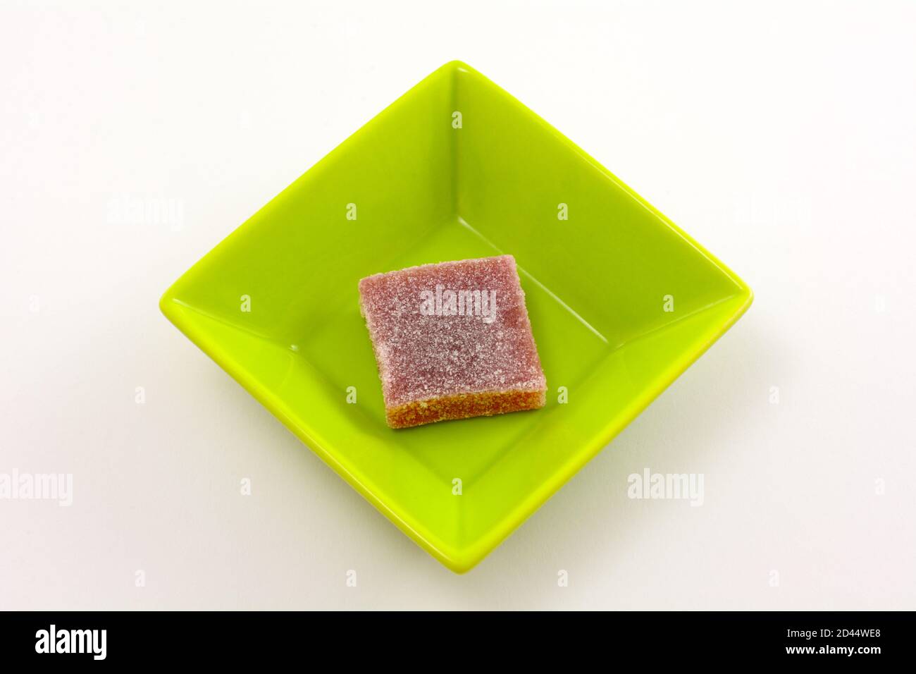 Prickly pear cactus jelly gummy candy square in small green candy bowl ...