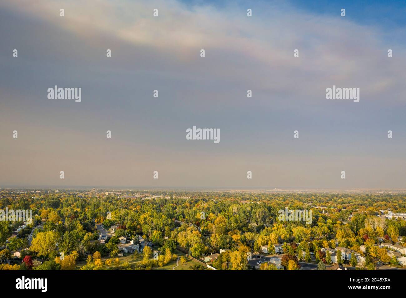 fall colors under wildfire smoke - aerial cityscape of Fort Collins in ...