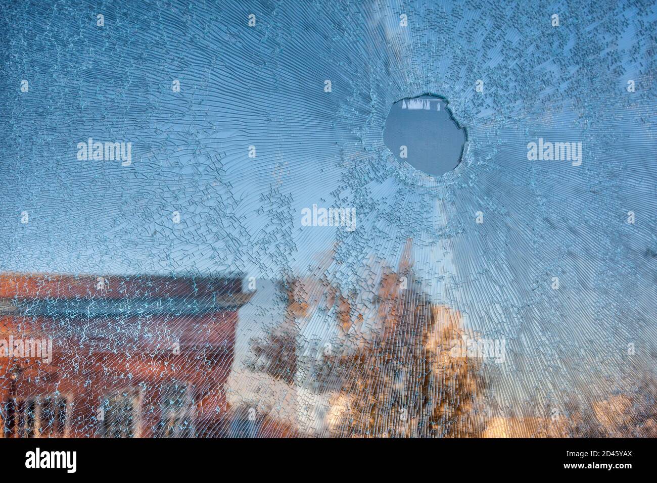 shattered glass window with sky and buildings reflections Stock Photo ...