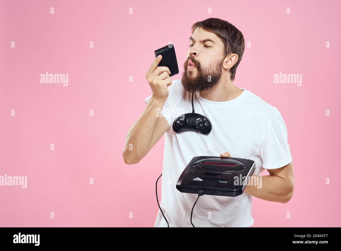 Man with prefix in hand joystick games lifestyle fun pink background ...