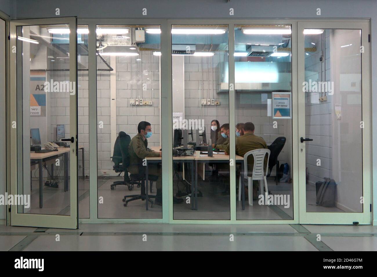 RAMLA, ISRAEL - OCTOBER 08: Military personnel using computers to ...