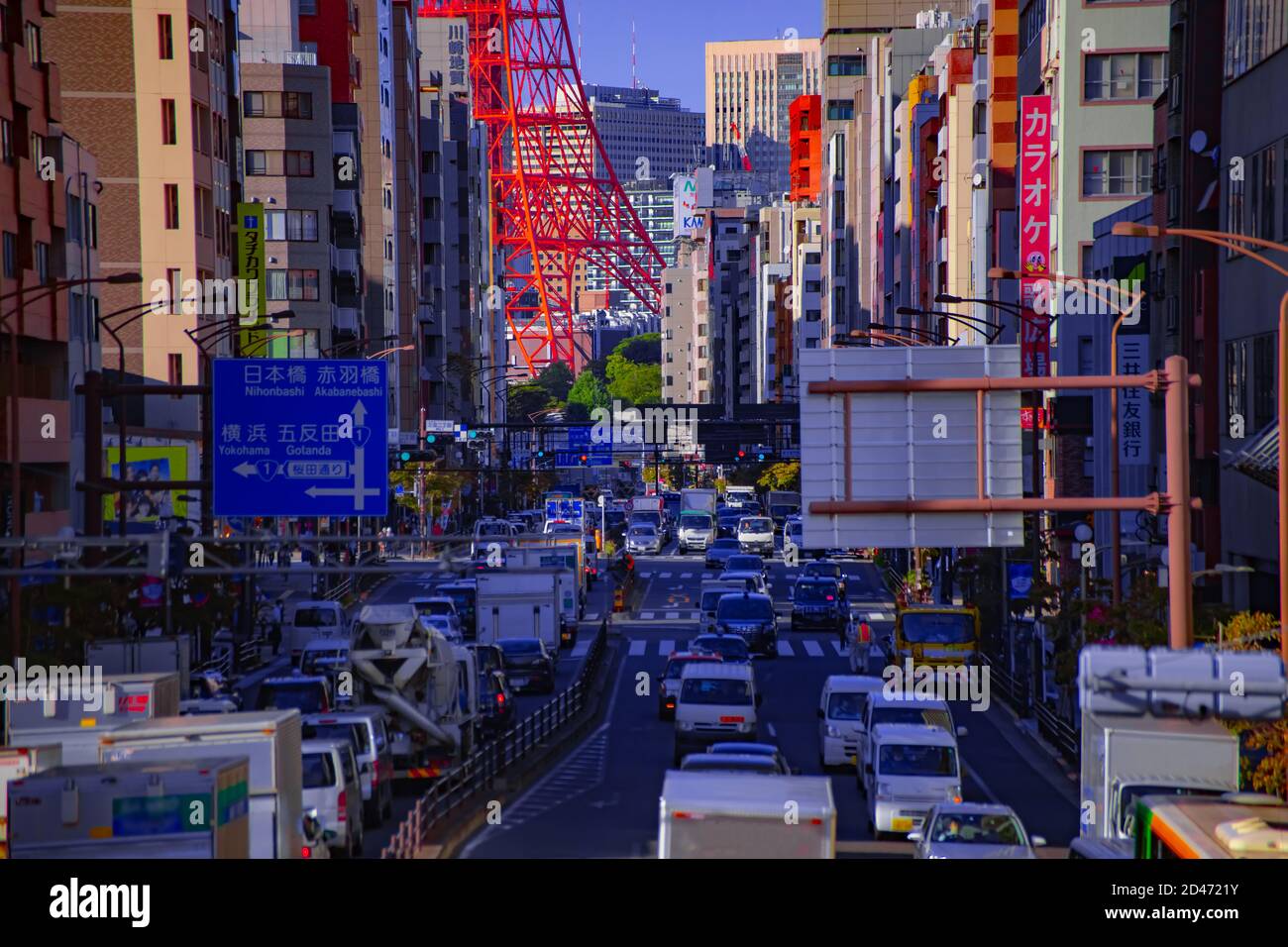 A traffic jam at the urban street behind Tokyo tower long shot Stock ...