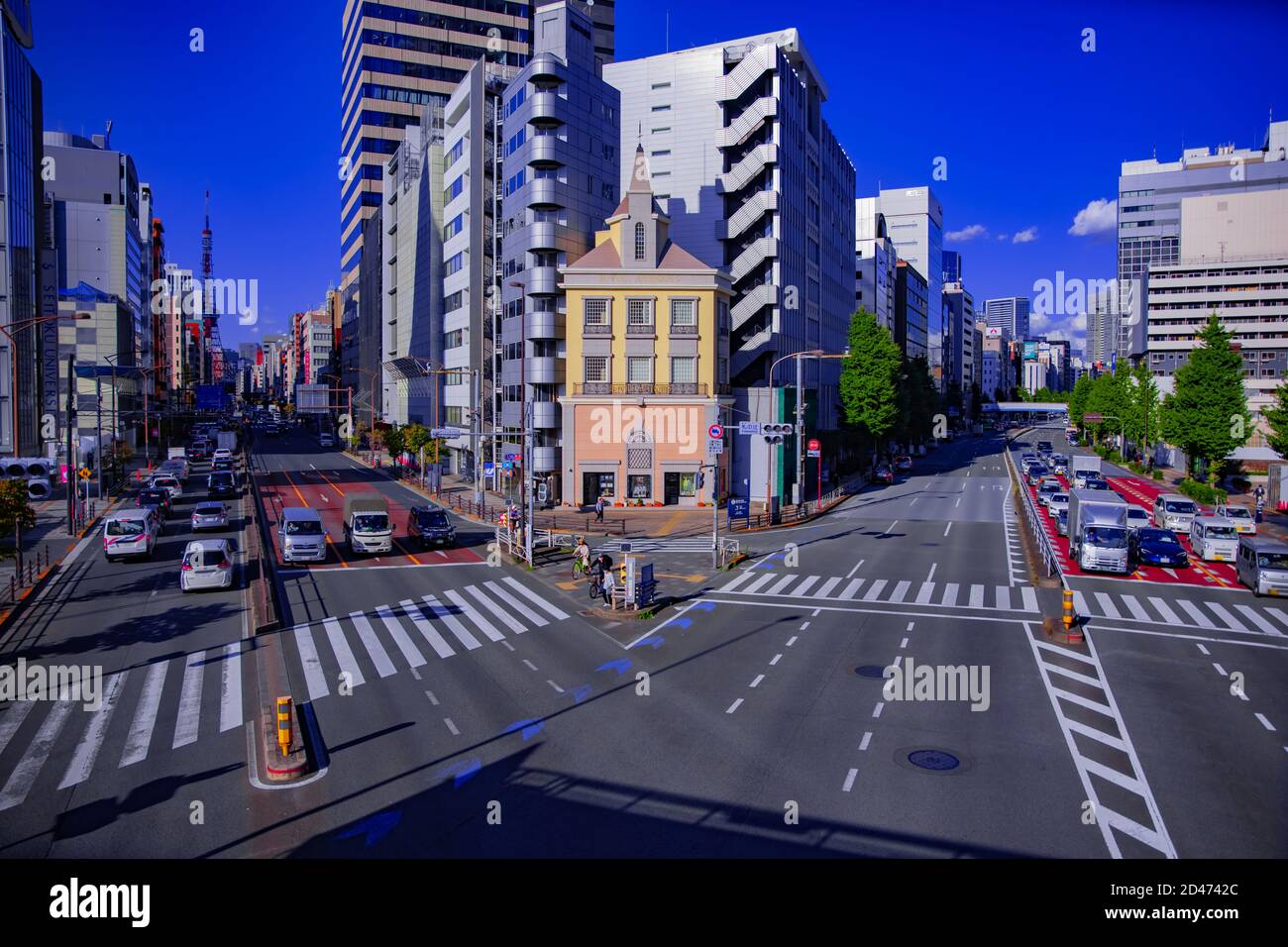 A traffic at the urban street behind Tokyo tower in Tokyo wide shot ...