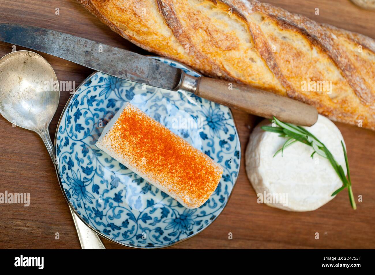French cheese and fresh baguette on a wood cutter Stock Photo - Alamy