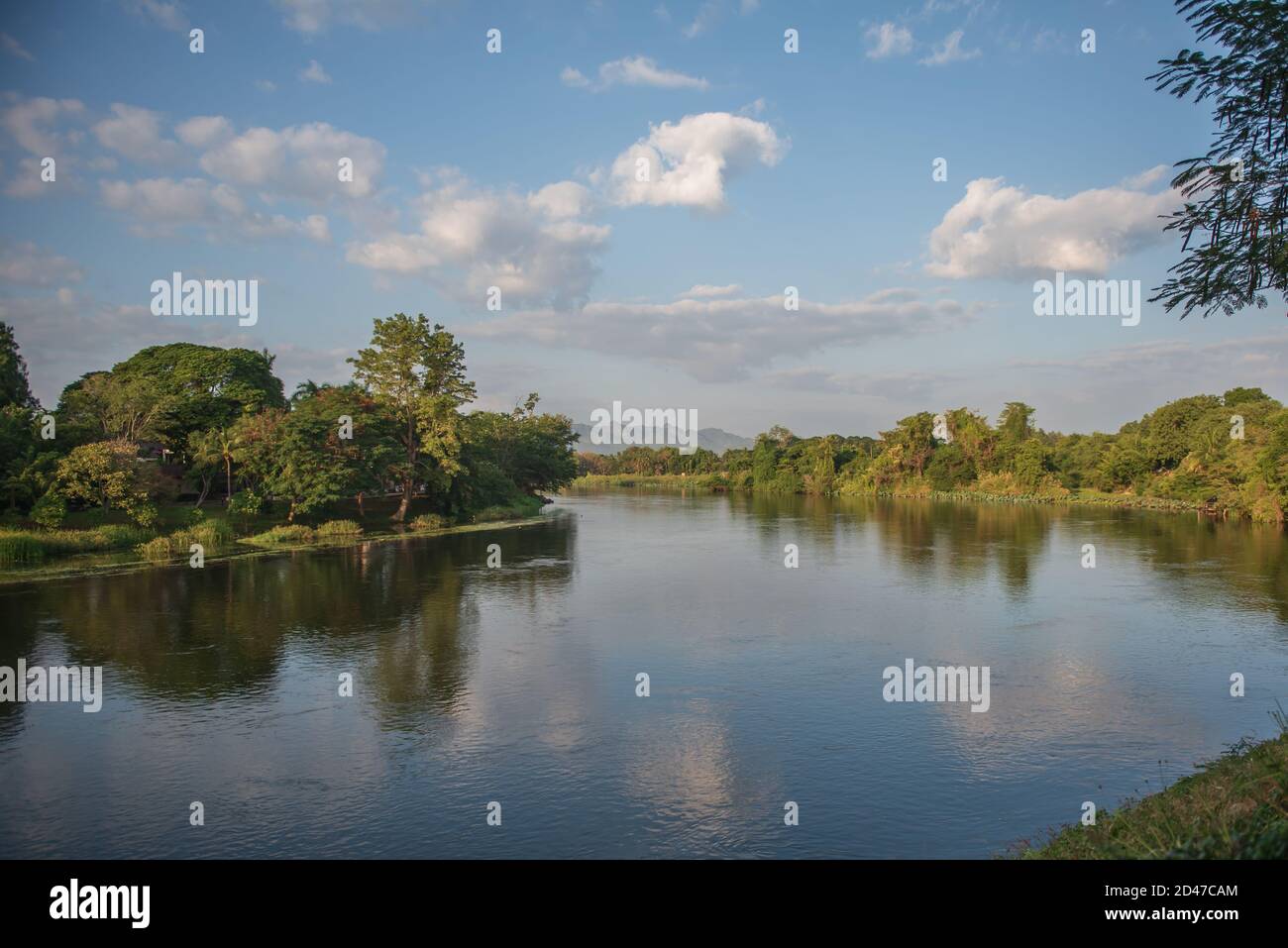 Landscape of Clean river view surrounded by green trees, distant ...