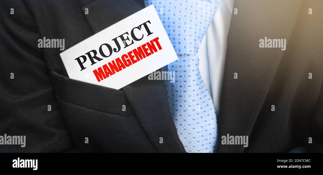 PROJECT MANAGEMENT words on card businessman keeps in his upper pocket ...