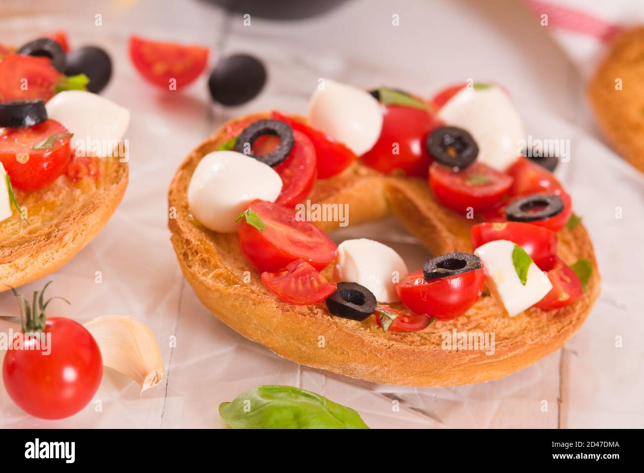 Friselle with tomatoes and mozzarella cheese Stock Photo - Alamy