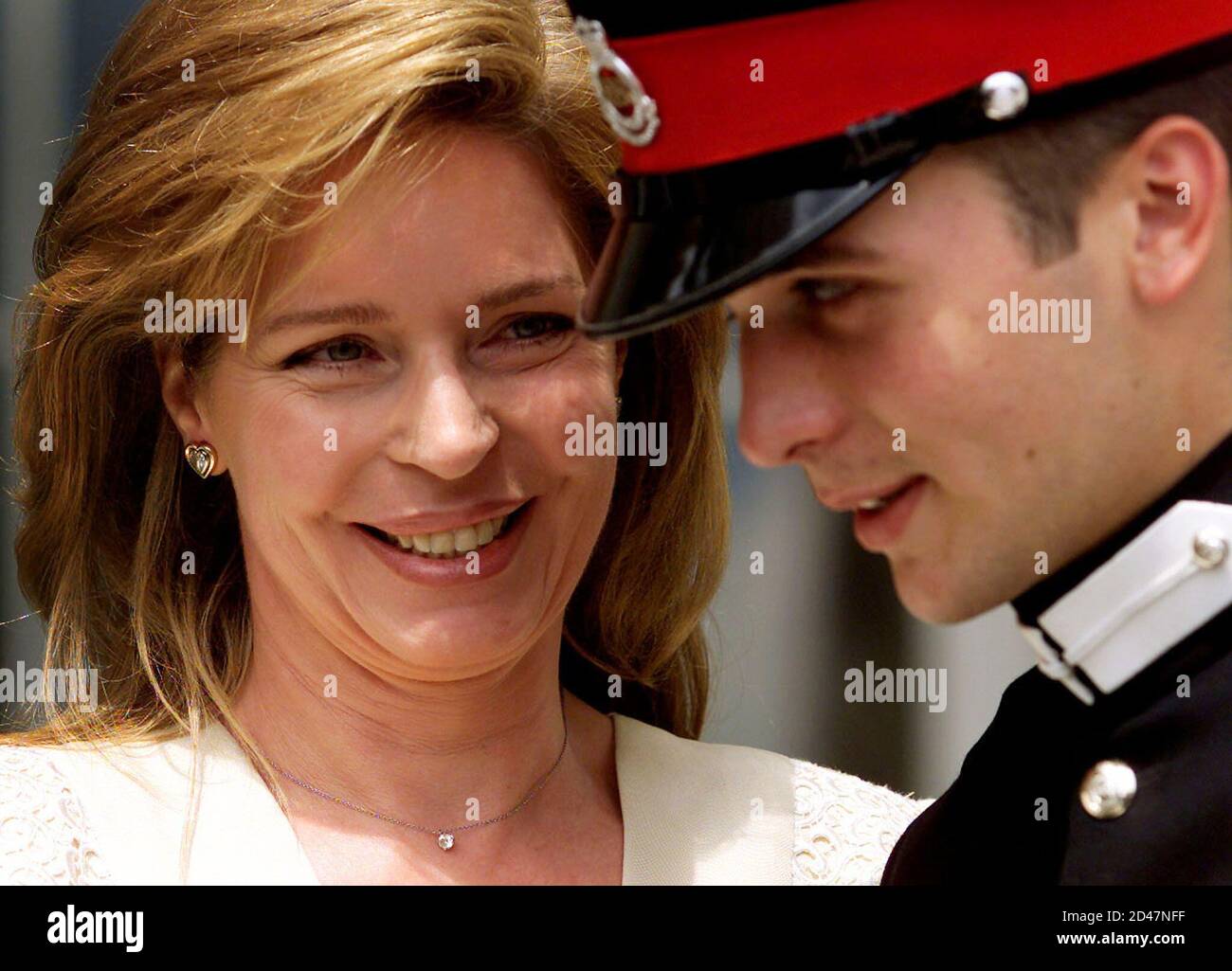 Queen Noor of Jordan (L) smiles at her son Hashim after his passing out ...