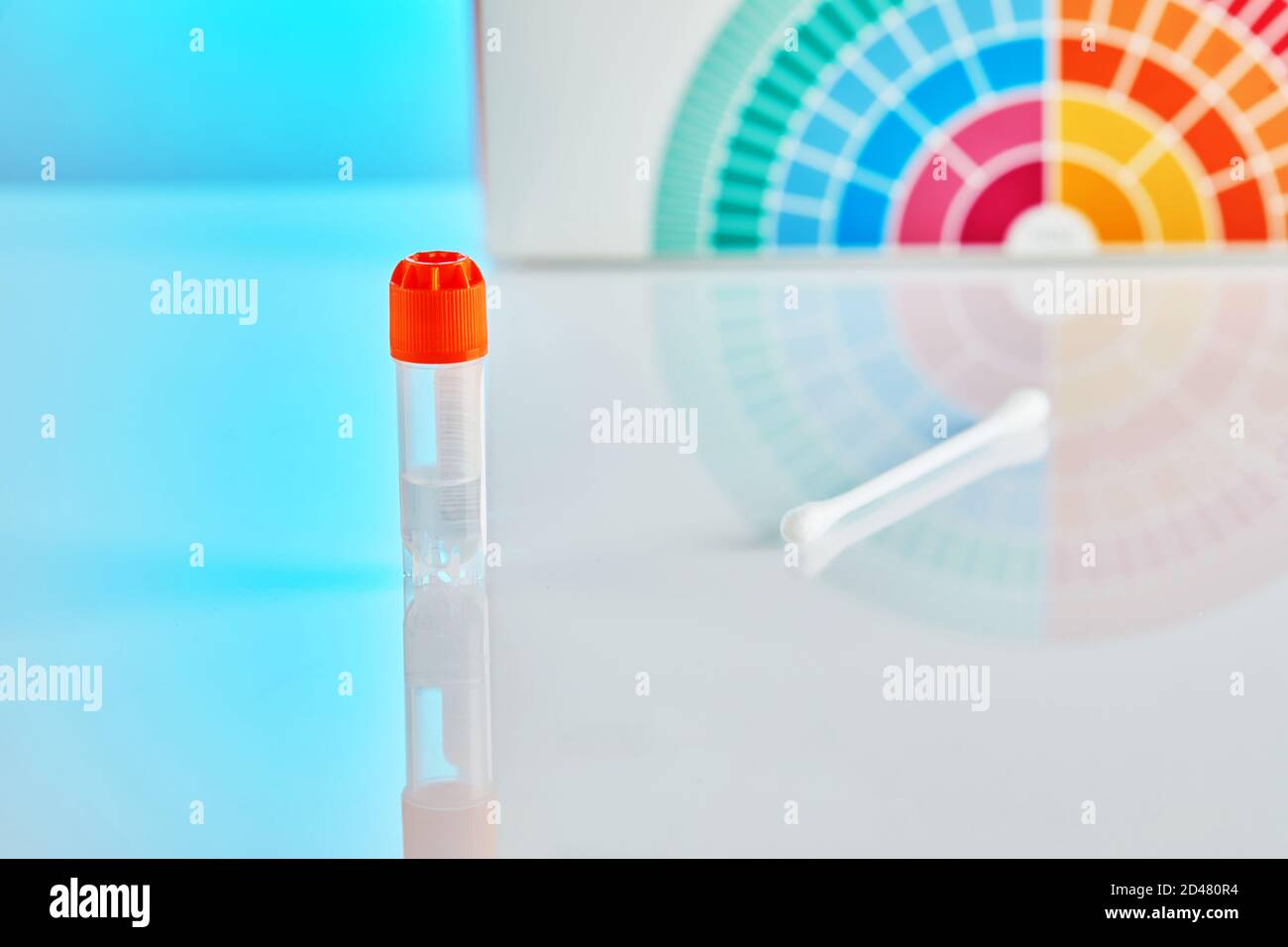 A test tube with a liquid for DNA analysis and a stick against the ...