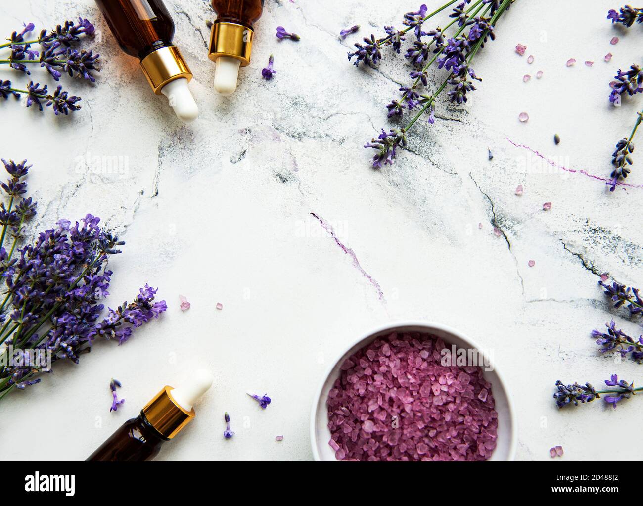 Natural herb cosmetic with lavender, flatlay on white marble background ...