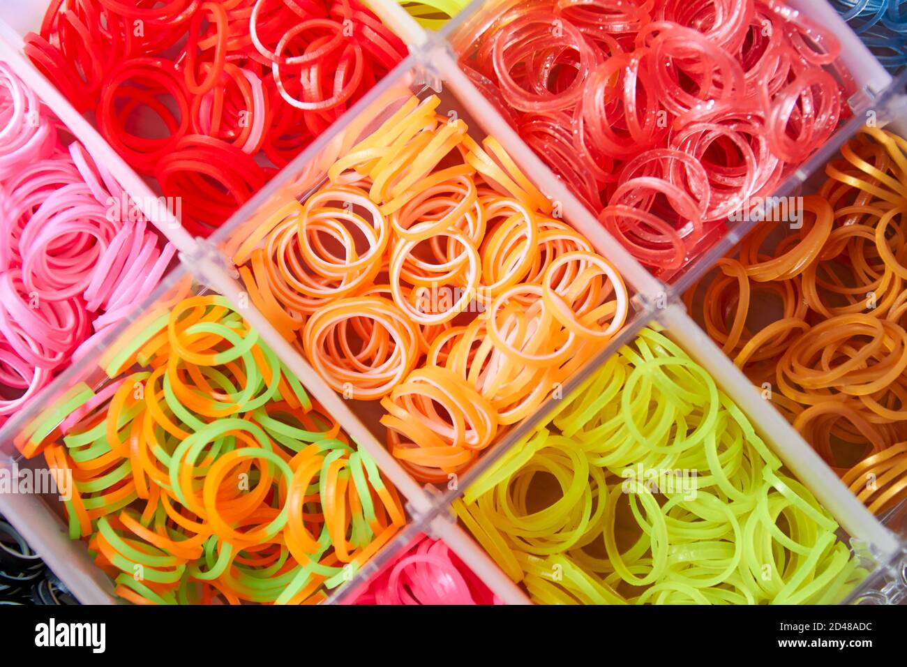 A set of colorful rubber bands and loom knit for knitting wristbands ...