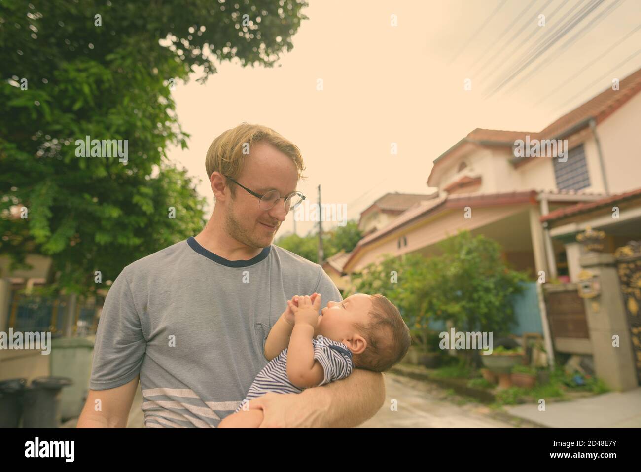 Father and baby son bonding together at home outdoors Stock Photo - Alamy