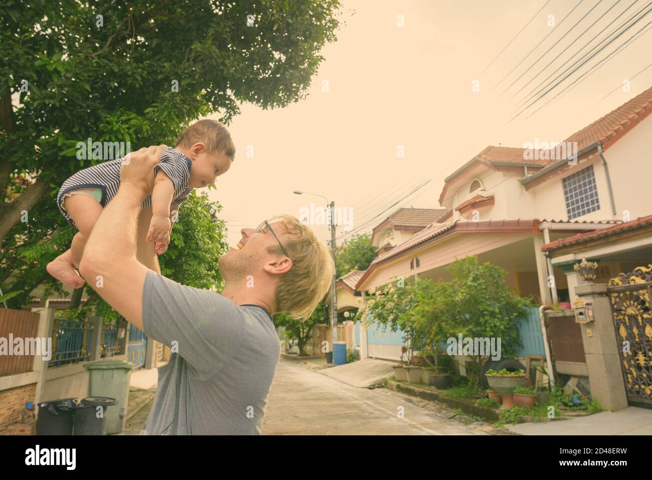 Father and baby son bonding together at home outdoors Stock Photo - Alamy