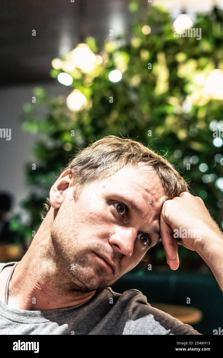 Front closeup vertical portrait Young serious pensive man thinking ...