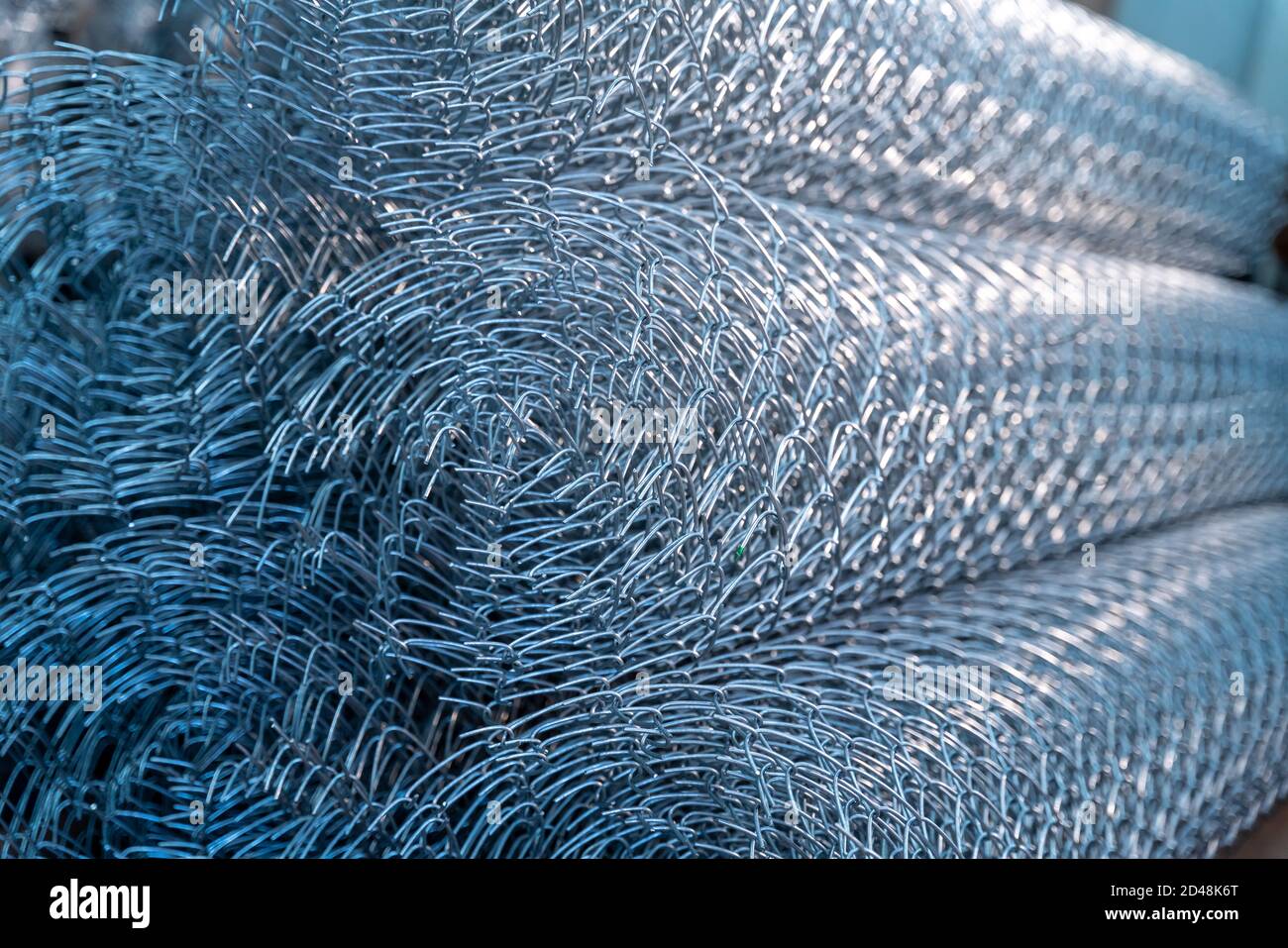 Rolls of steel wire mesh for construction work in warehouse Stock Photo ...