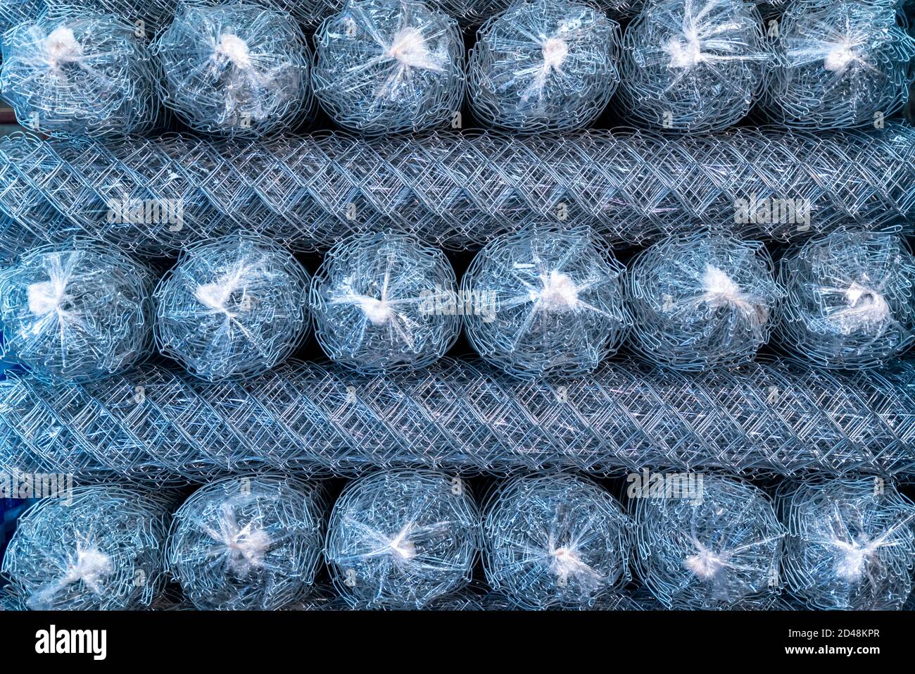 Rolls of steel wire mesh for construction work in warehouse Stock Photo ...