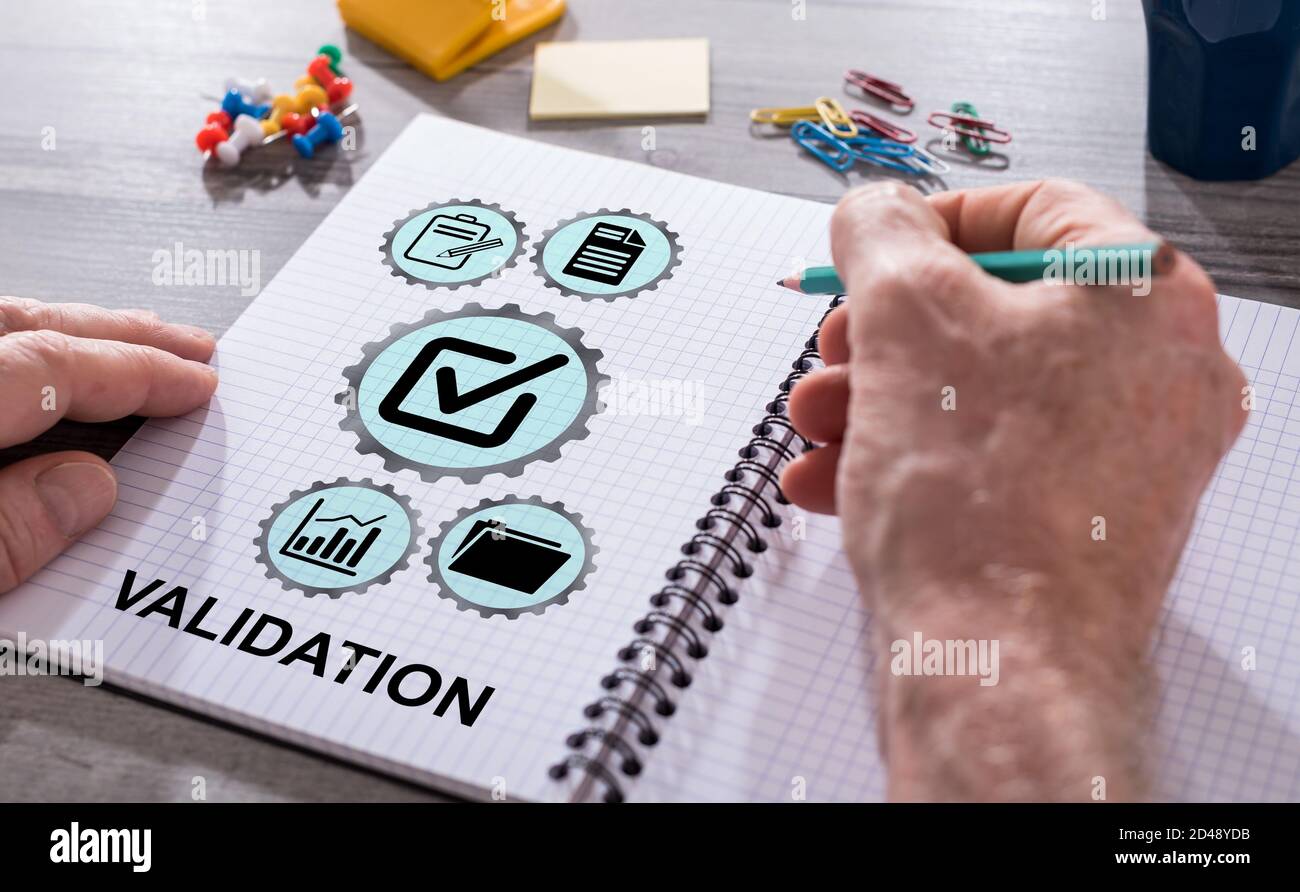 Hand drawing validation concept on a notepad Stock Photo - Alamy