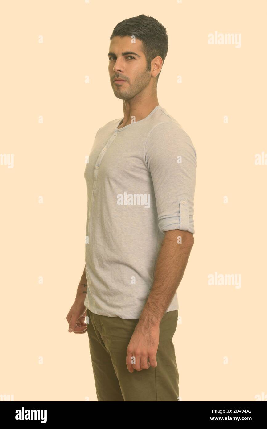 Portrait of young handsome Persian man looking at camera Stock Photo ...