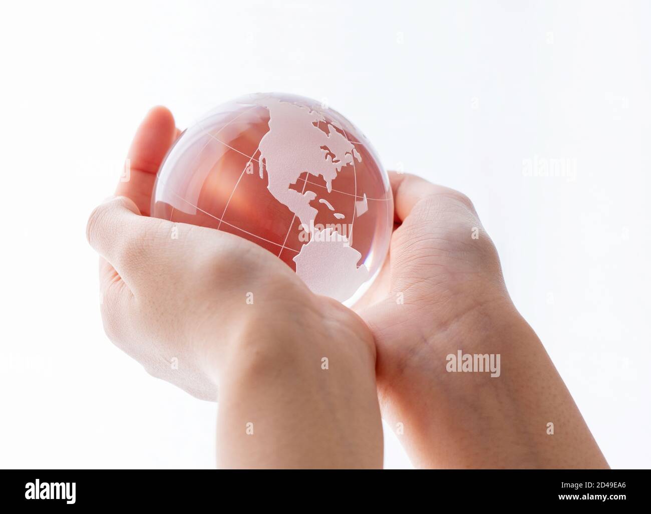 Human hand holding glass globe hi-res stock photography and images - Alamy